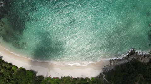 Aerial view zoom in of sand beach and wa... | Stock Video | Pond5