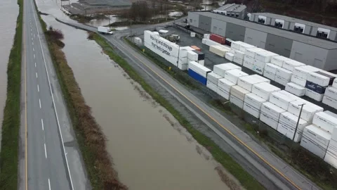 Aerial of warehouse cut off from road by... | Stock Video | Pond5