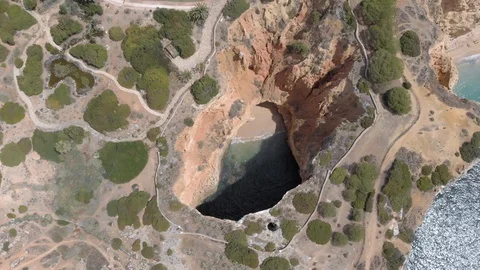 Aerial Zoom in, Cave in Carvoeiro. Drone... | Stock Video | Pond5