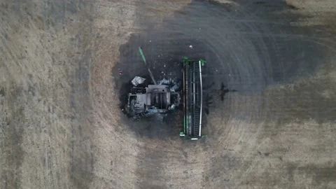 Aerial zooming out of burnt combine harv... | Stock Video | Pond5