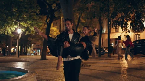 Affectionate boyfriend spinning woman in... | Stock Video | Pond5