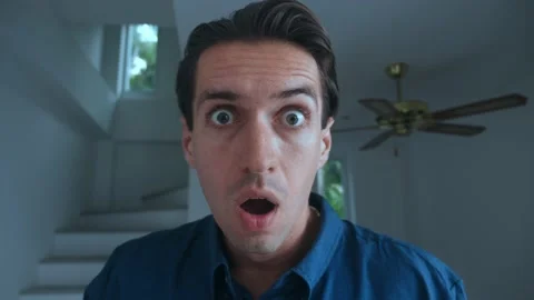 Afraid man looks into the camera and tak... | Stock Video | Pond5