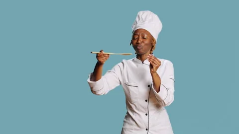 African american cook doing food taste t... | Stock Video | Pond5