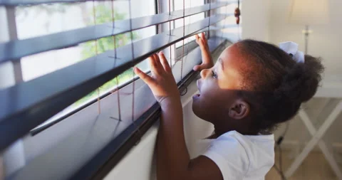Girl Looking Out Window Stock Footage ~ Royalty Free Stock Videos | Pond5