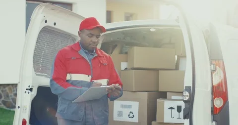 African American mailman in the red unif... | Stock Video | Pond5