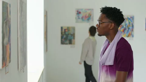 African American Man Observing Paintings... | Stock Video | Pond5