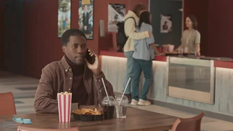African American Man Waiting for Movie a... | Stock Video | Pond5