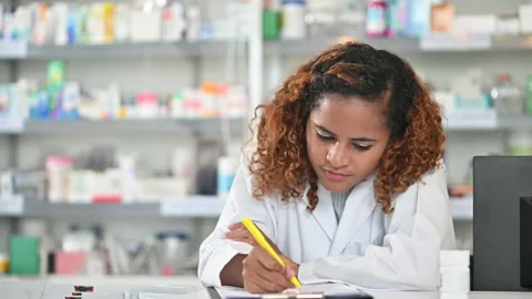 African American mixed-race female pharm... | Stock Video | Pond5