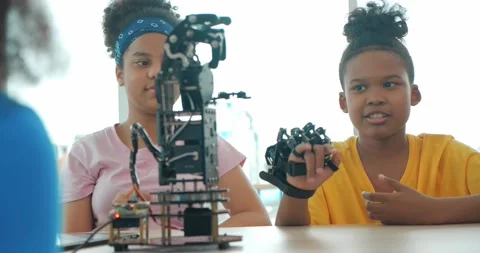 African black kids is playing with robot... | Stock Video | Pond5