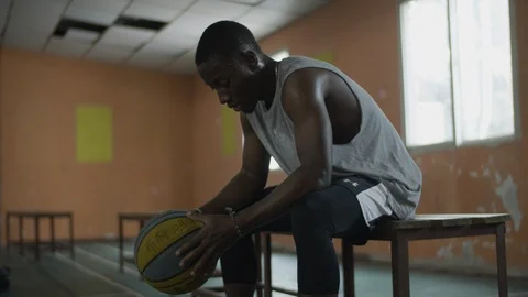 African boy takes a break on a bench aft... | Stock Video | Pond5
