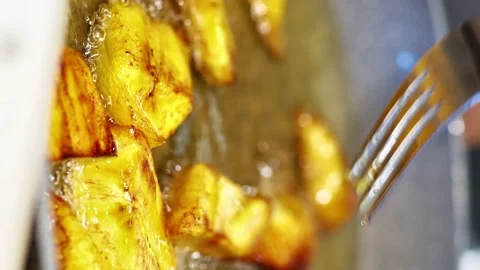 african chef frying plantain tree fruit ... | Stock Video | Pond5