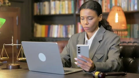 African Female Lawyer Using Phone with L... | Stock Video | Pond5
