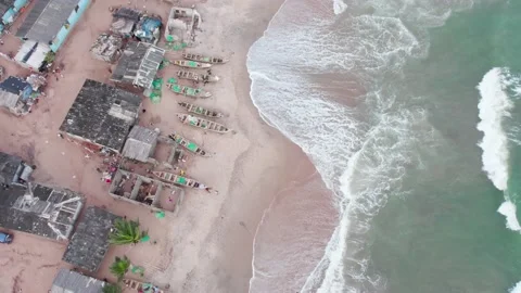 African fishing village on the beach wit... | Stock Video | Pond5