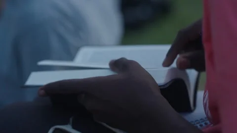 African Hand Turning Bible Pages | Stock Video | Pond5