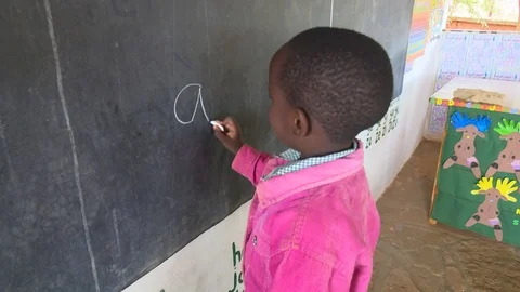 African Kids learning alphabet with Scho... | Stock Video | Pond5