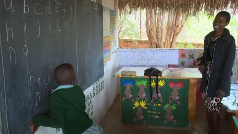 African Kids learning alphabet with Scho... | Stock Video | Pond5