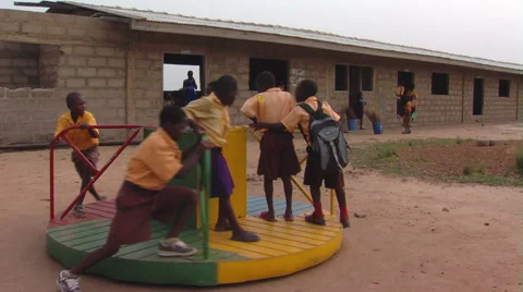 African kids playing on merry go round. | Stock Video | Pond5