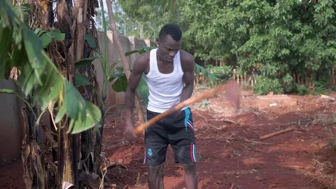An African man digging in his garden in ... | Stock Video | Pond5