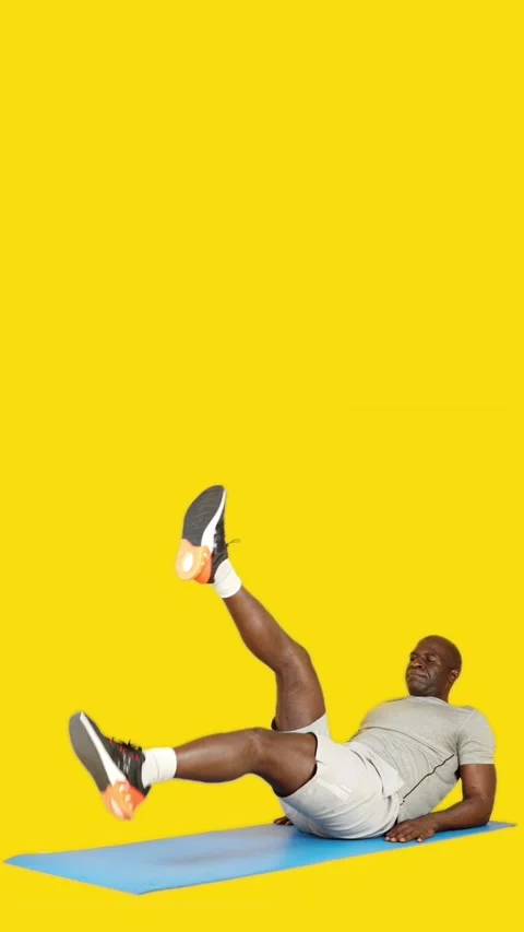 African man doing sitting scissor crunch... | Stock Video | Pond5