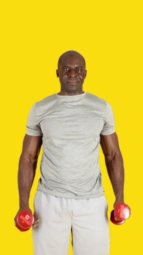 African man standing doing curl bicep ex... | Stock Video | Pond5