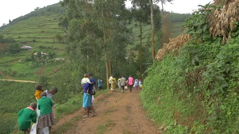 African people walking on a path | Stock Video | Pond5