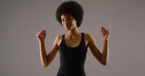 African woman in black dress with afro d... | Stock Video | Pond5