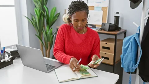 African woman budgeting with south afric... | Stock Video | Pond5