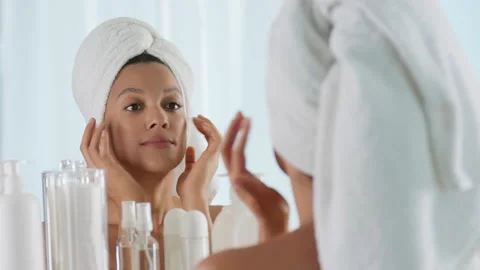 African woman touches face tapping and s... | Stock Video | Pond5