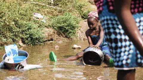 African woman washing clothes at the Riv... | Stock Video | Pond5