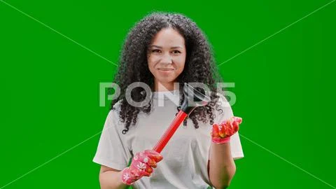 Afro female advertising plunger for toilet cleaning on a green screen ...