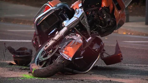 Aftermath of a motorcycle crash. Helmet ... | Stock Video | Pond5