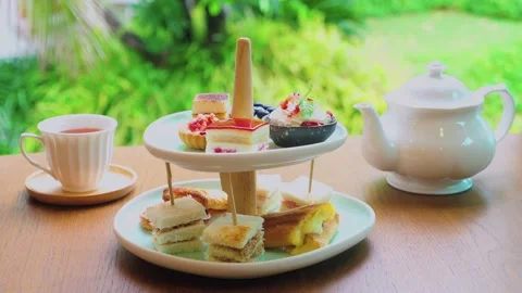 Afternoon tea stand with assortment of s... | Stock Video | Pond5