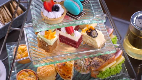 Afternoon tea tower, overflowing with fr... | Stock Video | Pond5