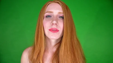 Against a green backdrop, a young women ... | Stock Video | Pond5