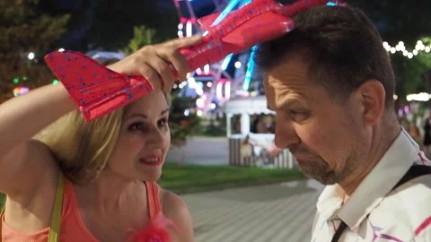 An aged woman knocking head of her husba... | Stock Video | Pond5