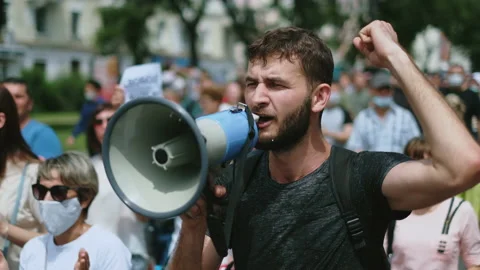 Aggressive protester with bullhorn on ra... | Stock Video | Pond5