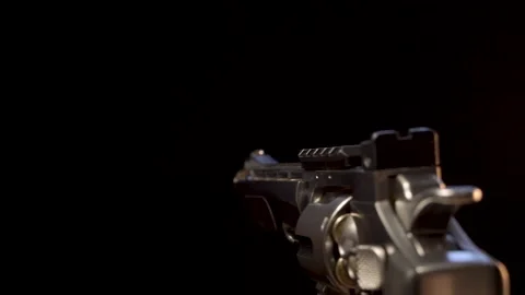 Aiming and firing a revolver pistol on a... | Stock Video | Pond5