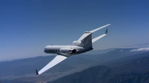 Air-to-air rear view of jet drifting lef... | Stock Video | Pond5