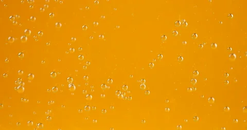 Air bubbles on an orange background. | Stock Video | Pond5