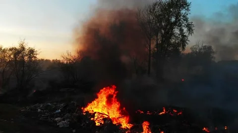 Air pollution caused by fire on dump sit... | Stock Video | Pond5
