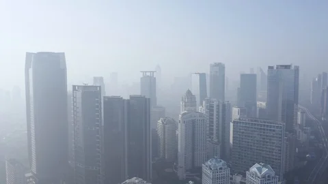 Air pollution covering skyscrapers at mo... | Stock Video | Pond5