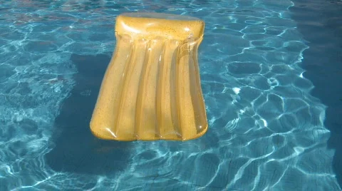 Air raft bed floating on a swimming pool | Stock Video | Pond5