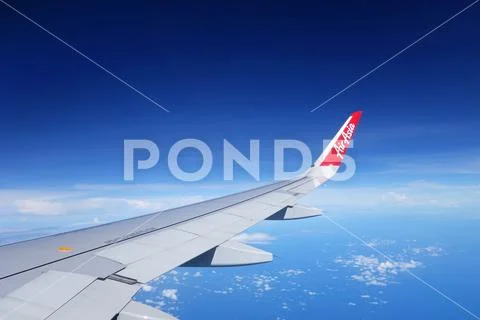 AirAsia plane flying in sky from Changi Airport, Singapore Stock Photo ...