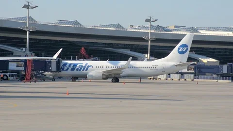 Aircraft stand at the air terminal gates... | Stock Video | Pond5