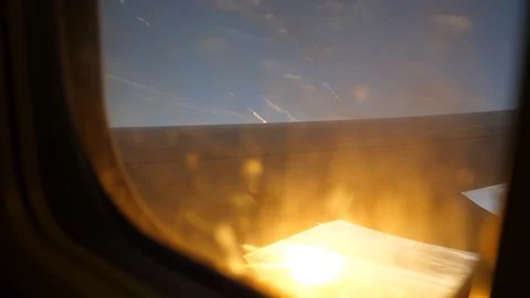 Aircraft window wing and sun above cloud... | Stock Video | Pond5