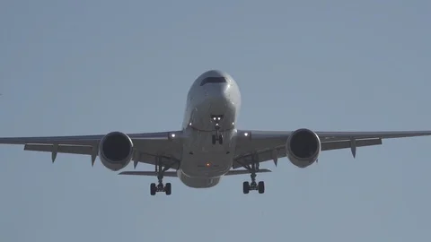 An airliner passes overhead on approach ... | Stock Video | Pond5