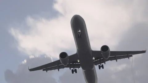 An airliner passes overhead on approach ... | Stock Video | Pond5