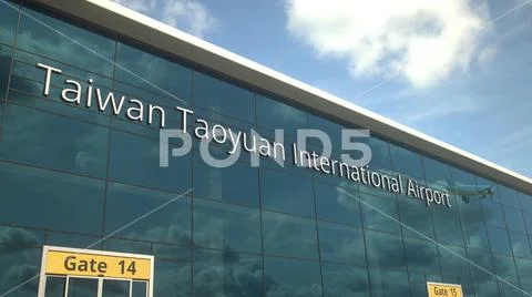 Airliner take off reflecting in the windows with Taiwan Taoyuan ...