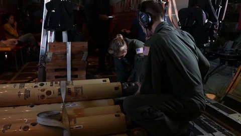 Airmen preparing dropsondes to drop into... | Stock Video | Pond5