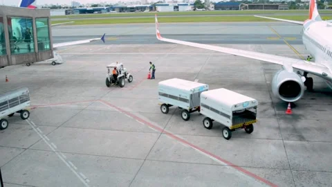 Airplane at airport runway being loaded | Stock Video | Pond5